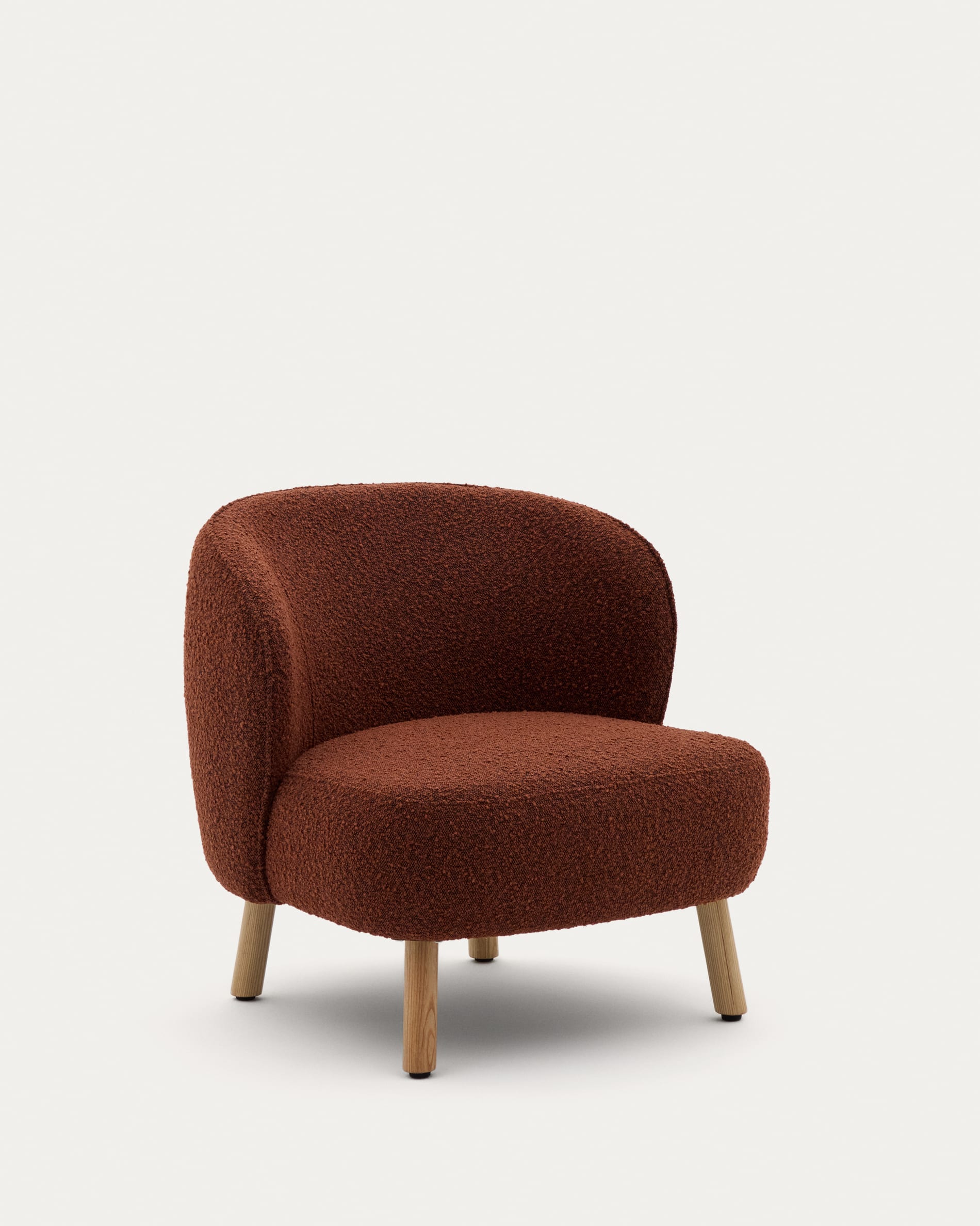 Ulit armchair in terracotta bouclé with solid beech wood legs in a ...