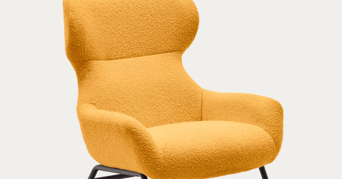 Poltrona Belina di tessuto bouclé color senape e acciaio con finitura ...